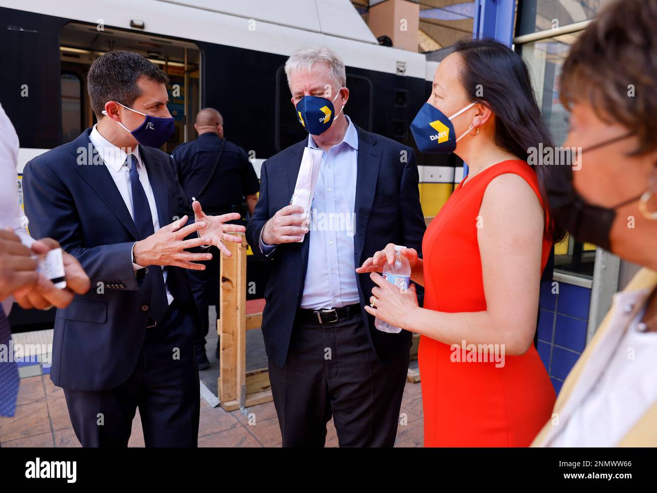 U.S. Transportation Secretary Pete Buttigieg, left, visits with new ...