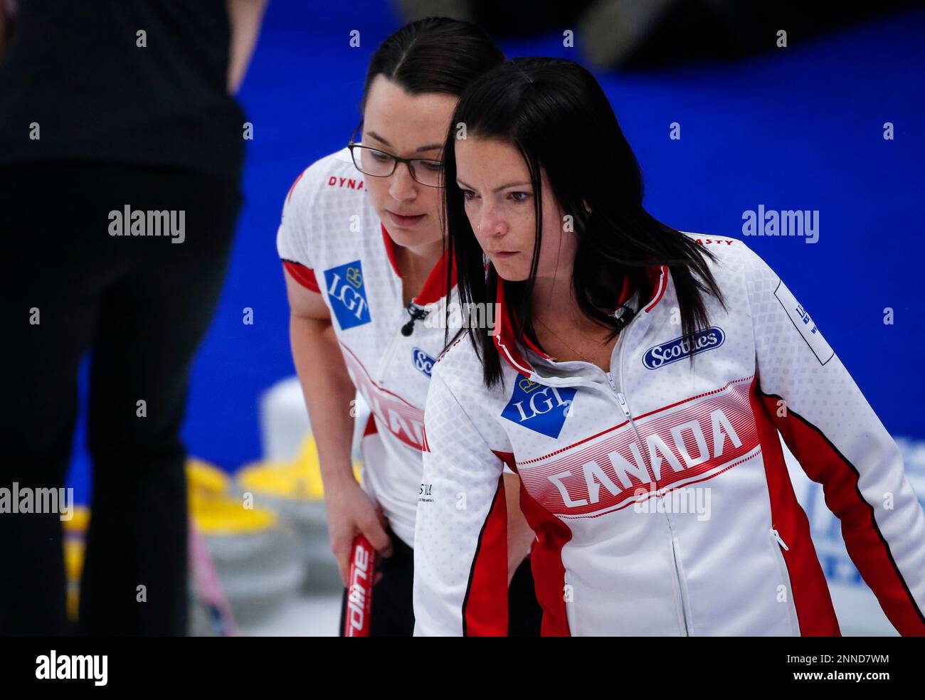 Team Canada skip Kerri Einarson, right, and third Val Sweeting discuss ...