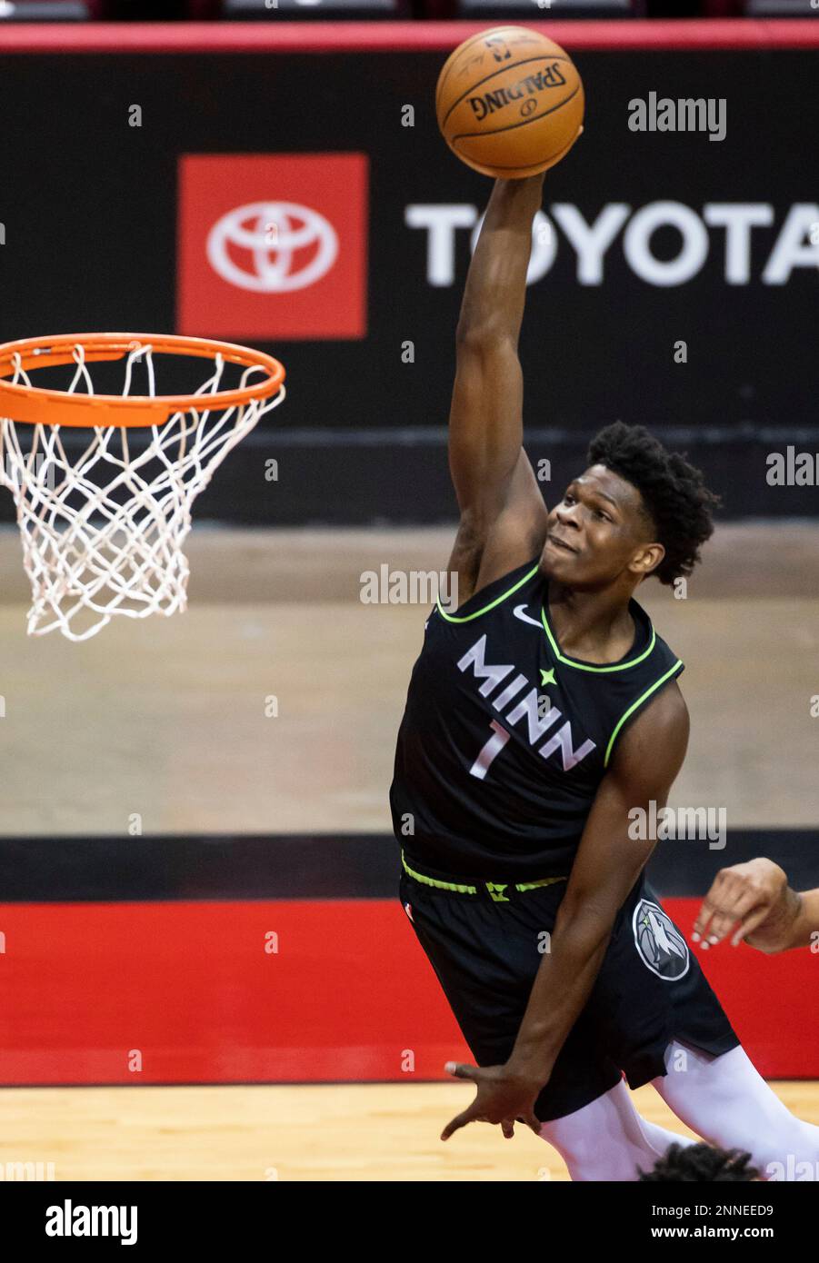 Minnesota Timberwolves forward Anthony Edwards dunks on a fast break ...