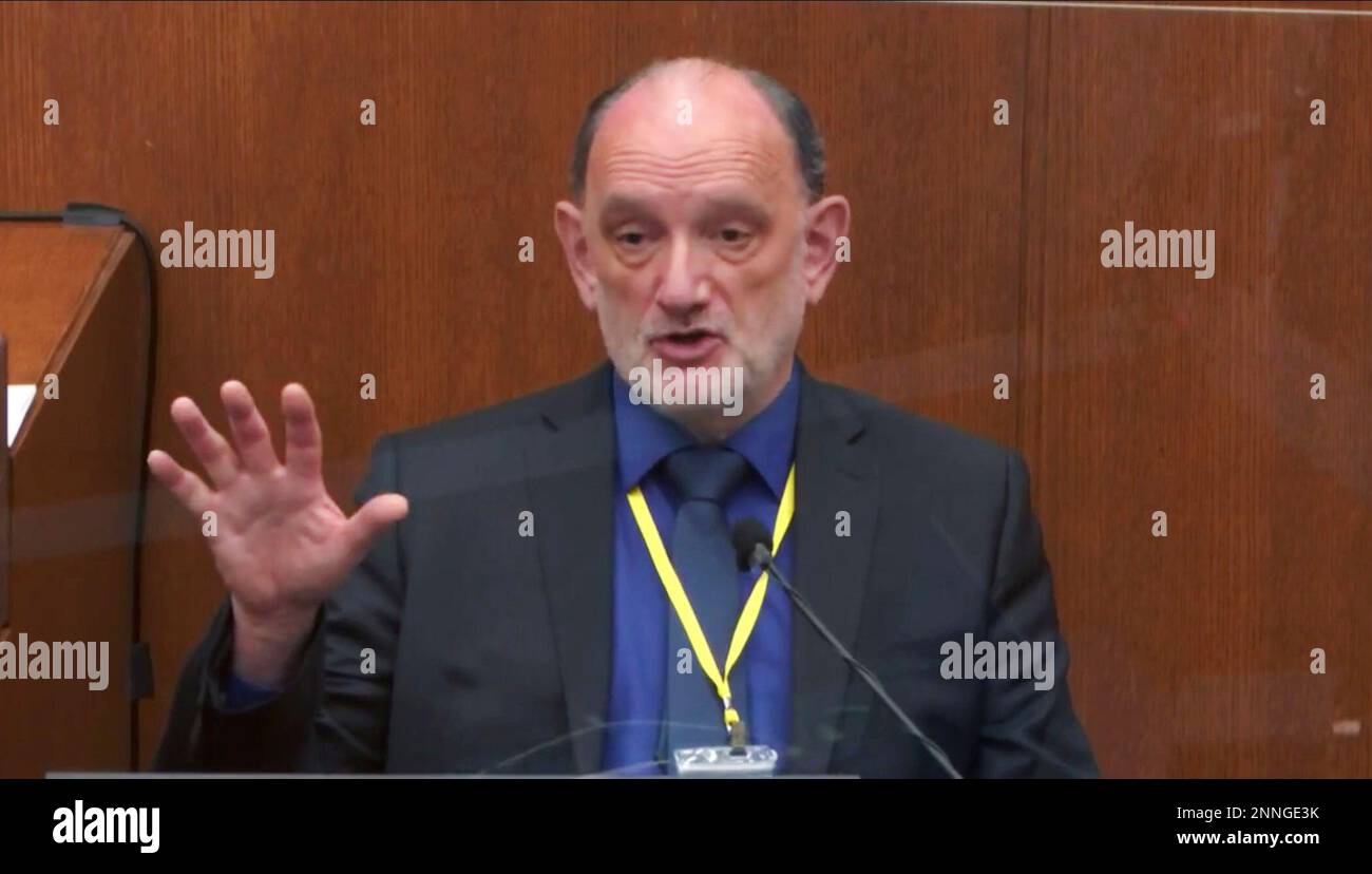 In this image from video, Dr. David Fowler, a retired forensic ...