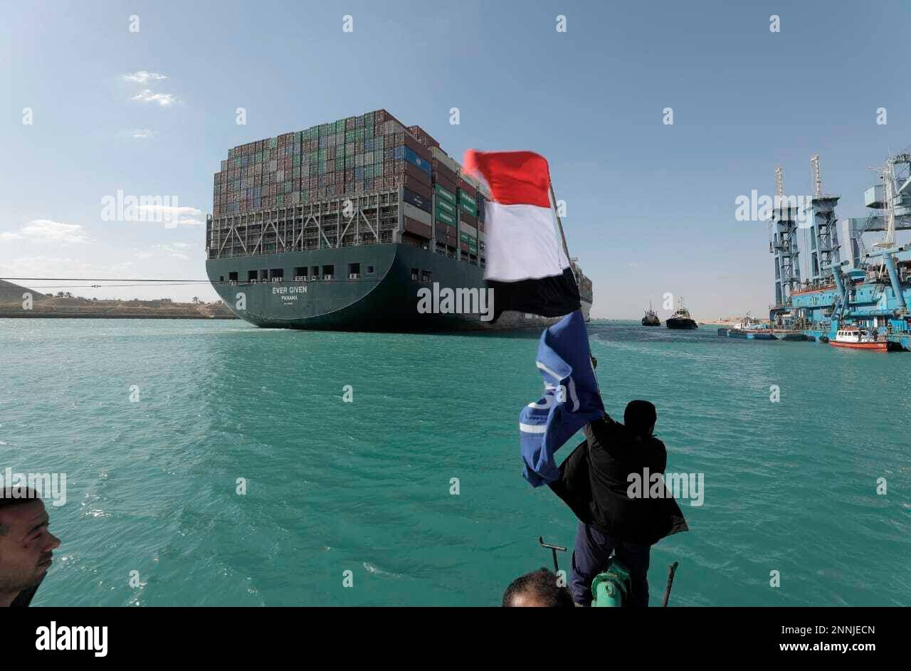 In this photo released by Suez Canal Authority, the Ever Given, a ...