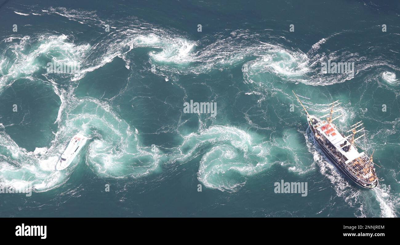 An aerial picture shows a tour boat cruising in the middle of Naruto ...