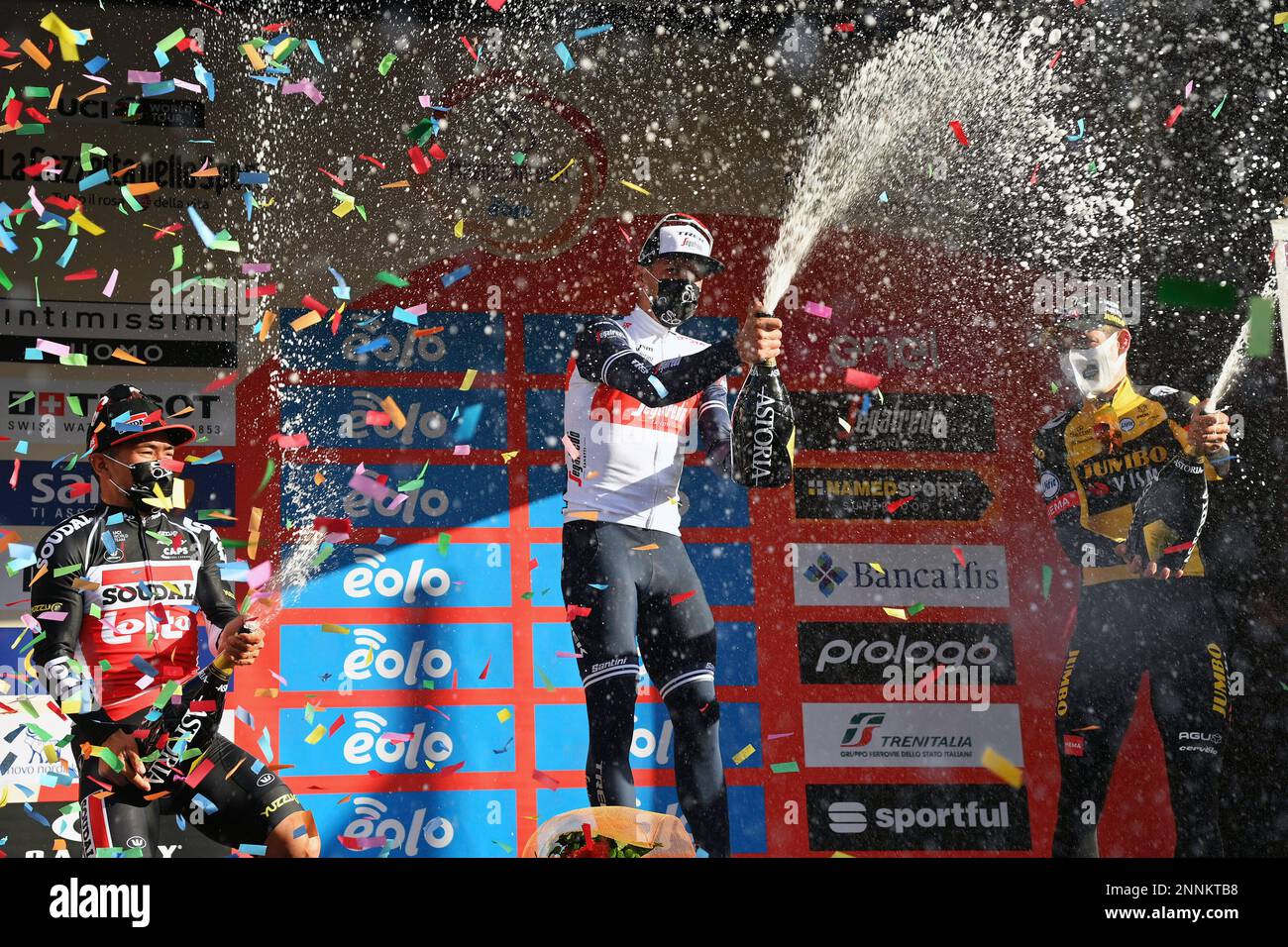 Belgium's Jasper Stuyven, center, winner of the Milan to Sanremo ...