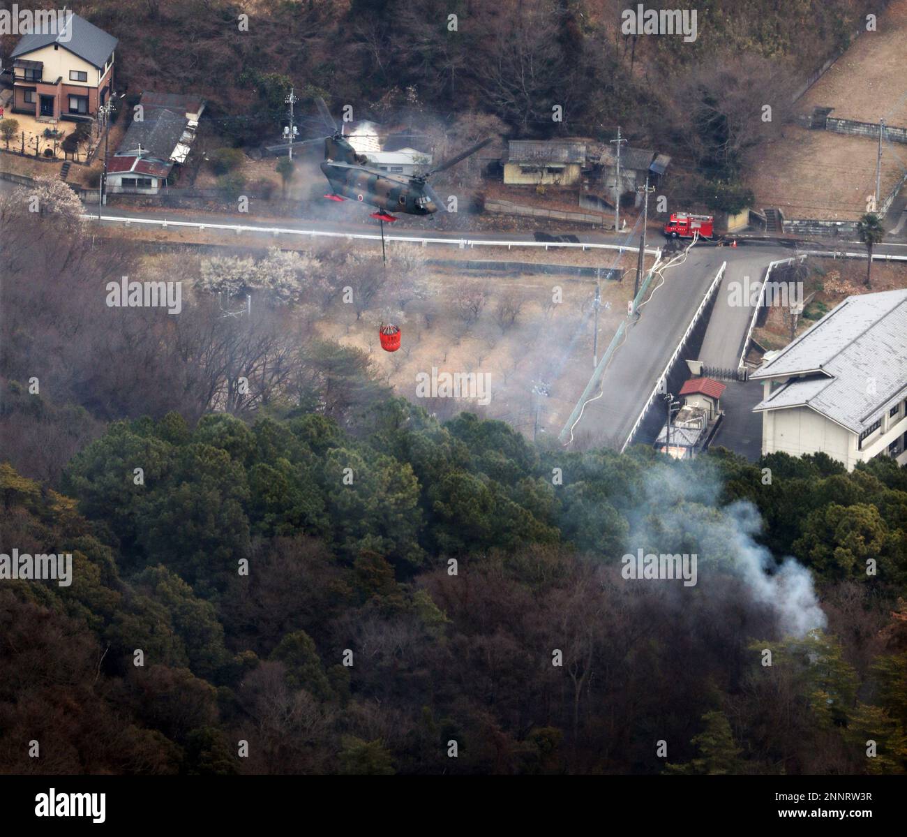 An aerial photo shows a forest fire that continues to spread near a ...
