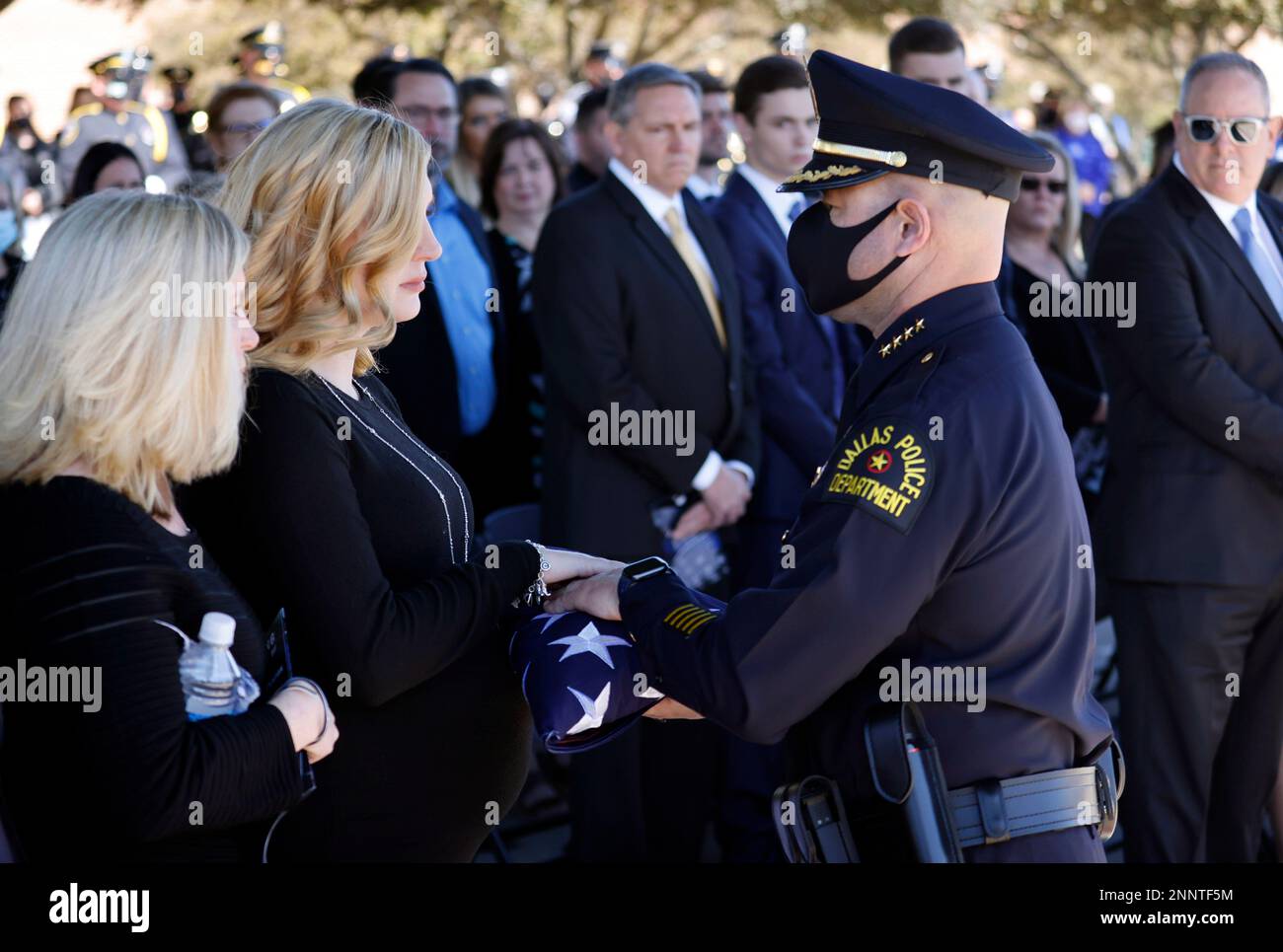 Dallas Police Chief Eddie Garcia (right) hands Nole Bergenske Penton ...