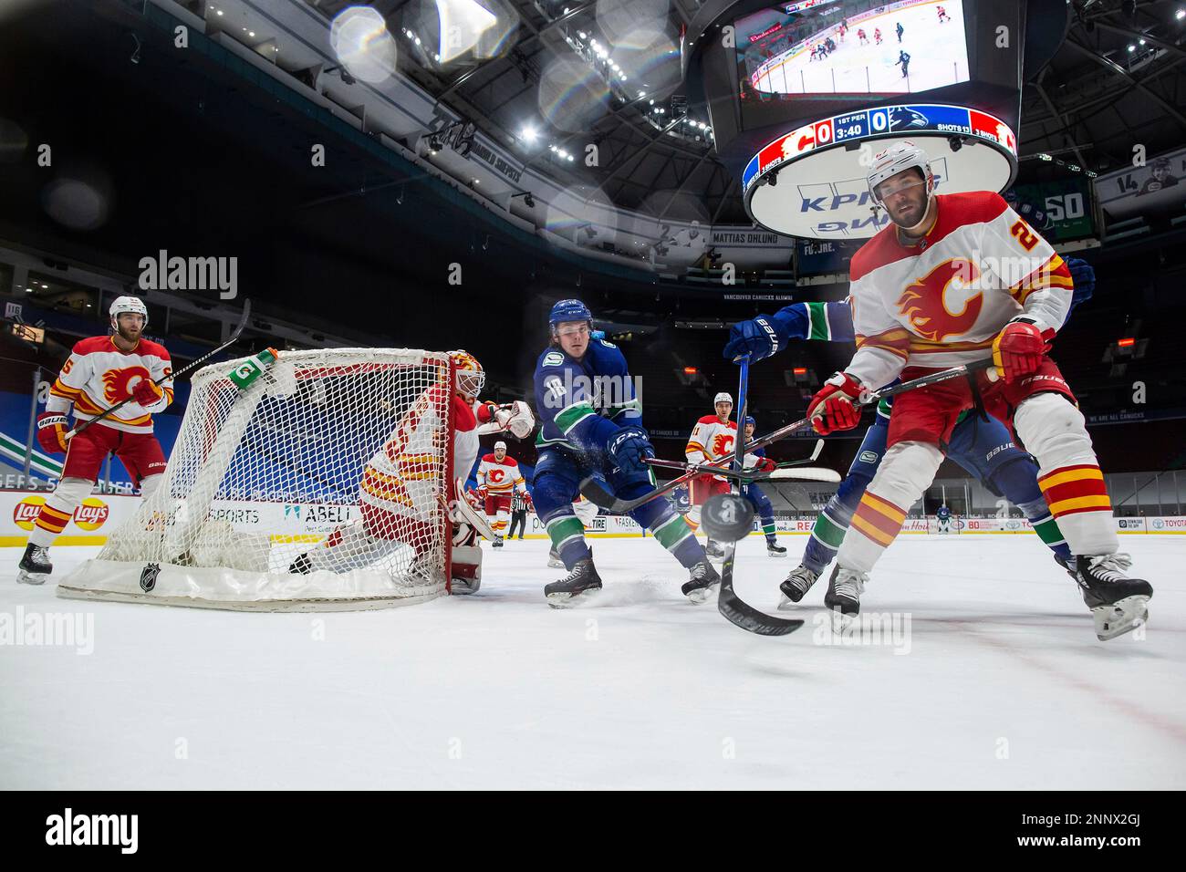 Vancouver Canucks' Jake Virtanen (18) and Calgary Flames' Josh Leivo ...