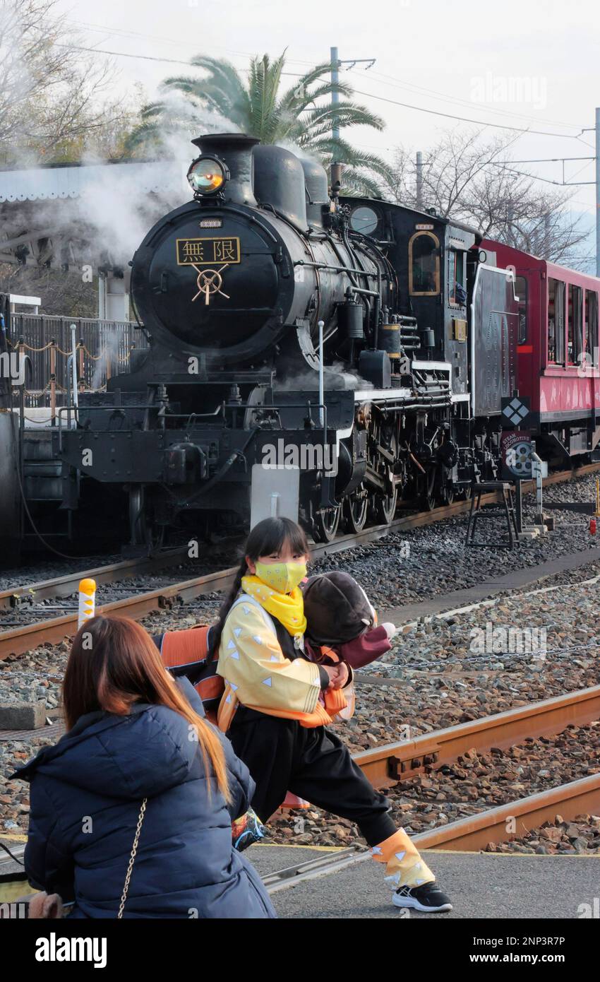 A steam train with a plate which says Mugen is displayed at Kyoto ...