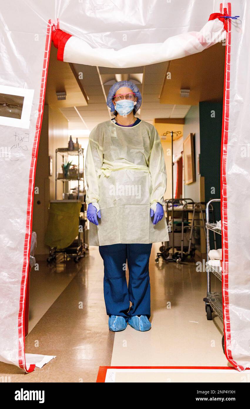 Nurse practitioner Sara Becker stands in a negative pressure space in ...