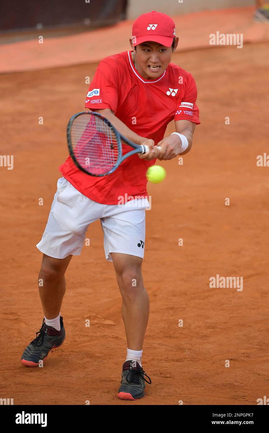 Japan's Yoshihito Nishioka returns the ball to Serbia's Miomir ...