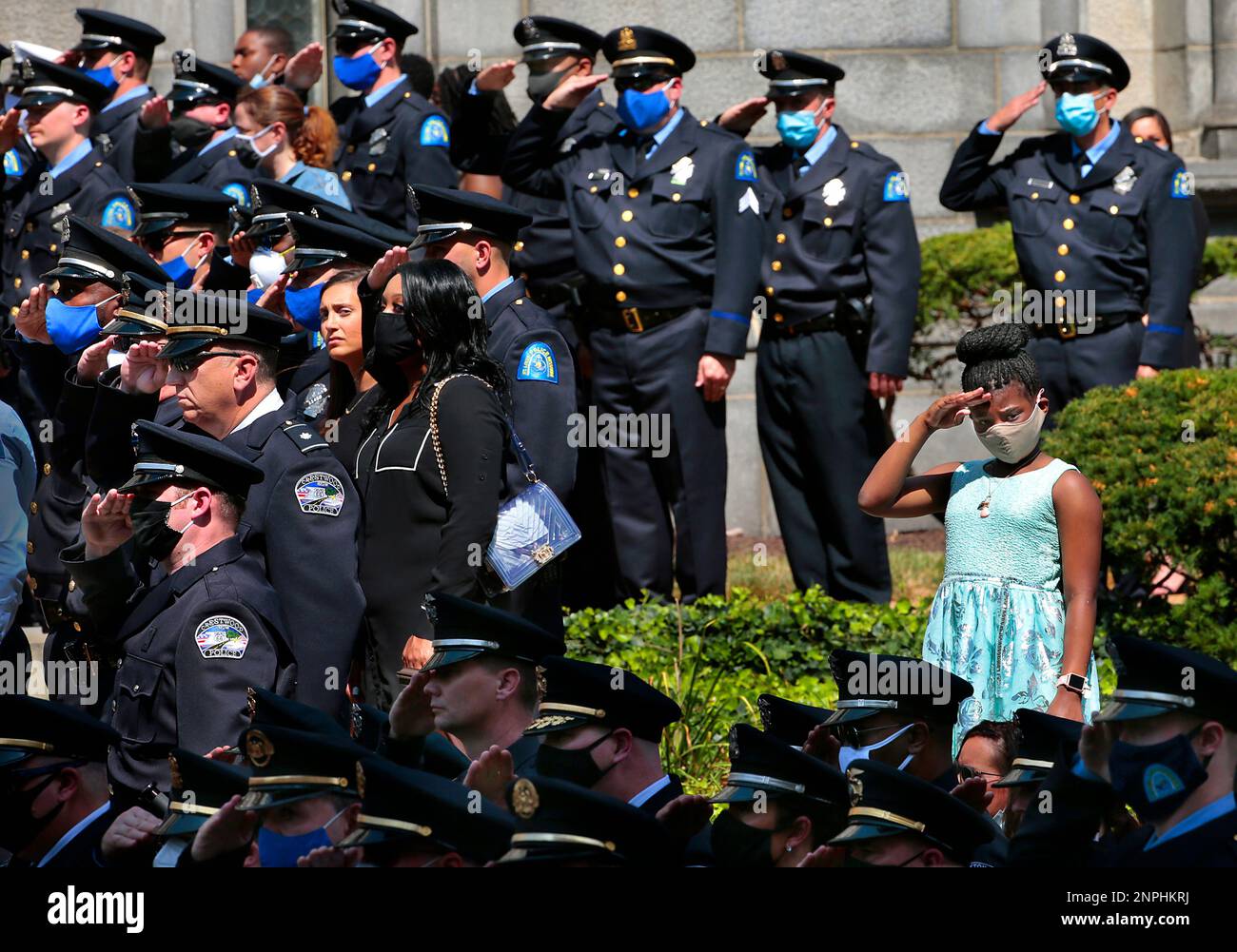 Joining police officers in saluting the remains of St. Louis police ...