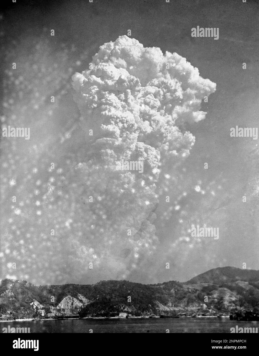 FILE- In this Aug. 6, 1945, file photo, smoke rises around 20,000 feet ...