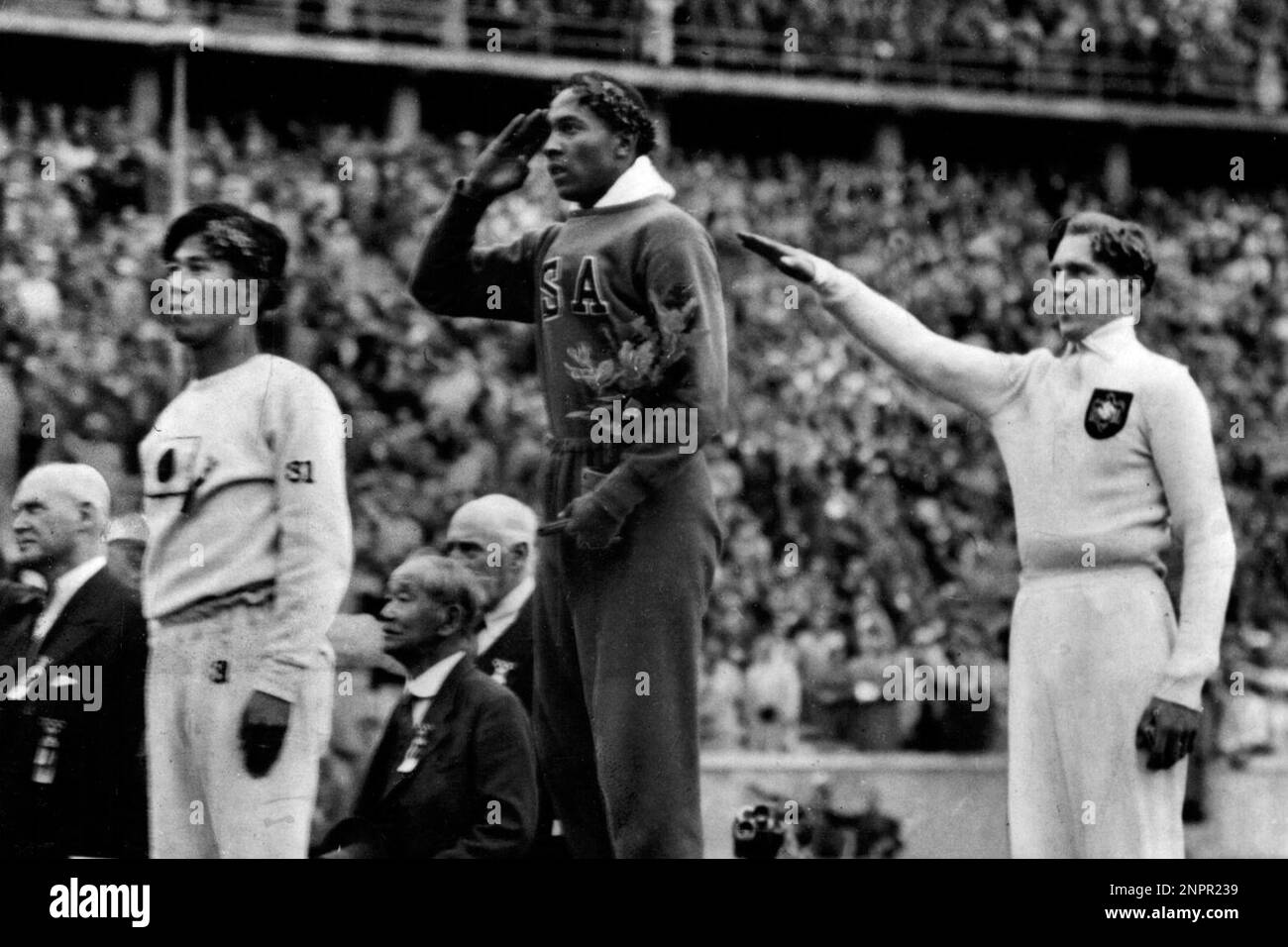 FILE - In this Aug. 11, 1936, file photo, America's Jesse Owens, center ...
