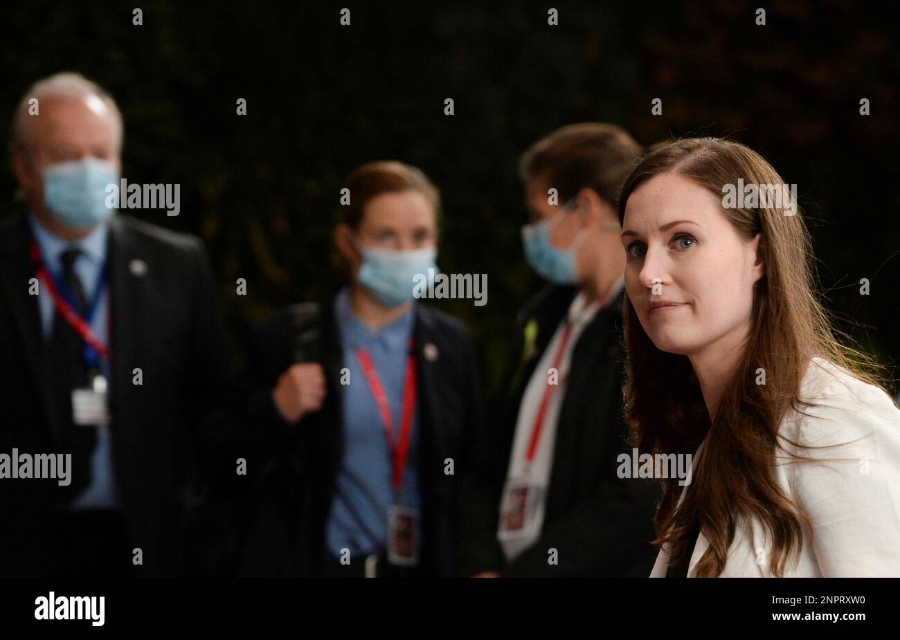 Finland's Prime Minister Sanna Marin, right, leaves the EU Council ...
