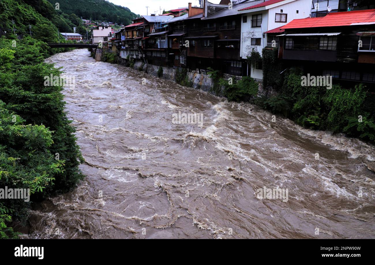 A photo shows swollen Kiso River due to heavy rain in Kiso Town, Nagano ...