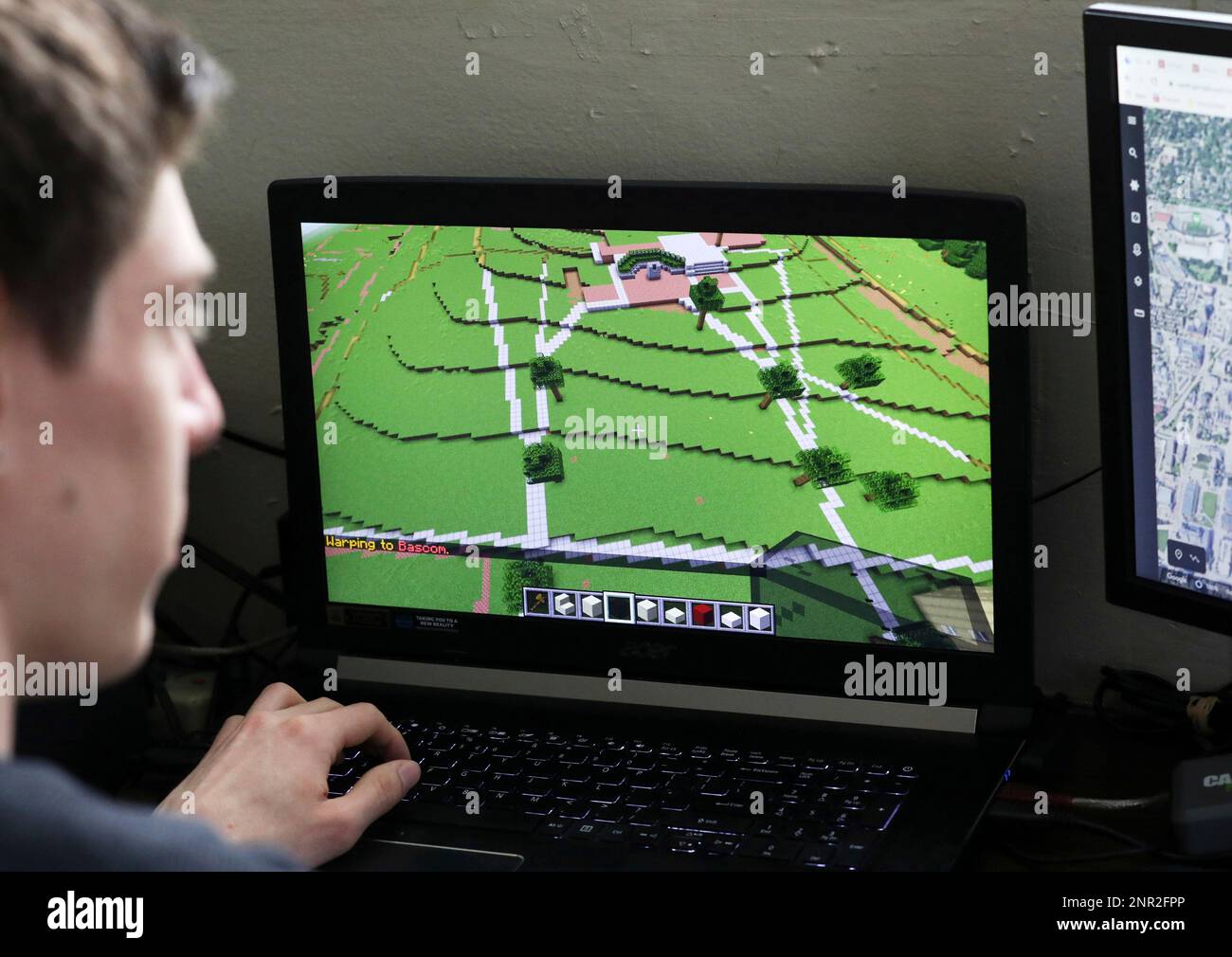 In this April 23, 2020, photo, UW-Madison graduate Zach Powers works on ...