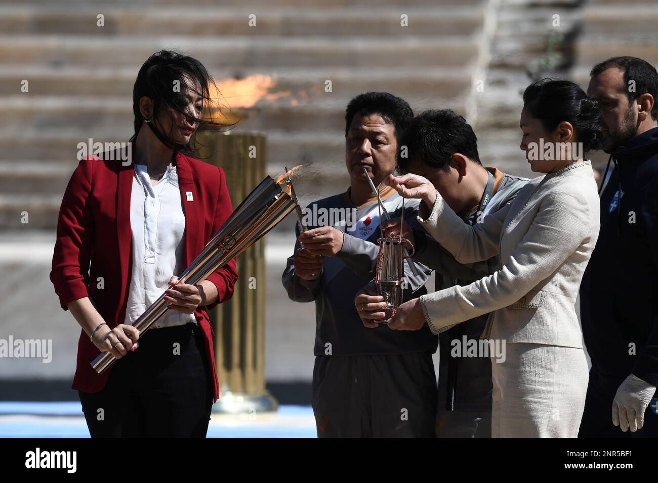 Former Japanese swimmer Imoto Naoko holds the Olympic torch during the ...