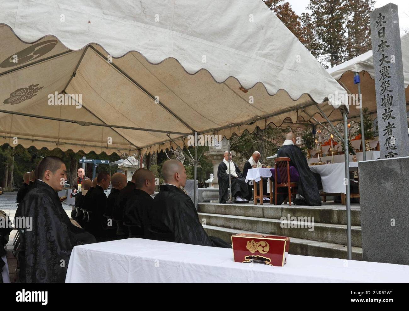 Thirty Buddhist monks chant a mantra for the victims of the 2011 ...