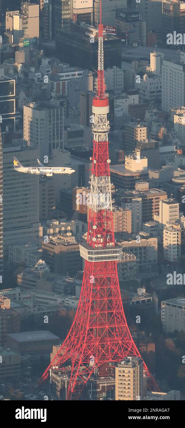 A airplane is flying near Tokyo Tower in Shinjyuku Ward, Tokyo on Feb.2 ...