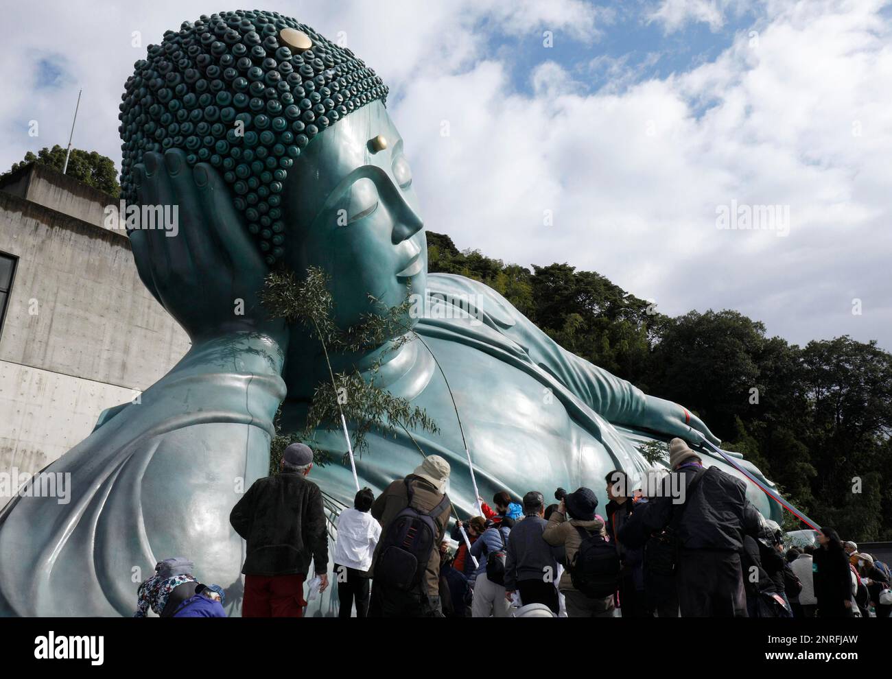 A Buddhist statue of great Nirvana is being cleaned by monks and local ...