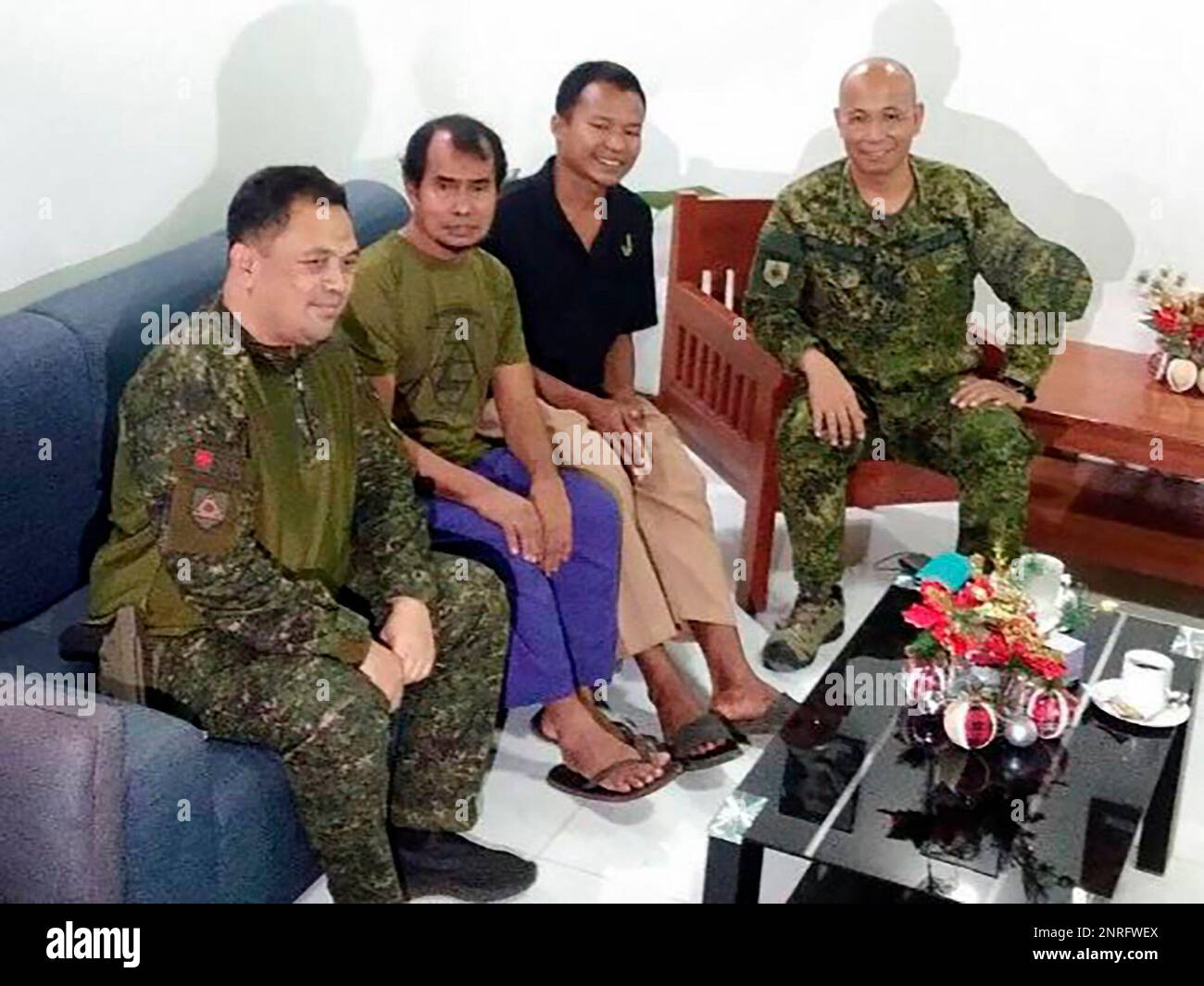 In this photo provided by the Western Mindanao Command, rescued ...