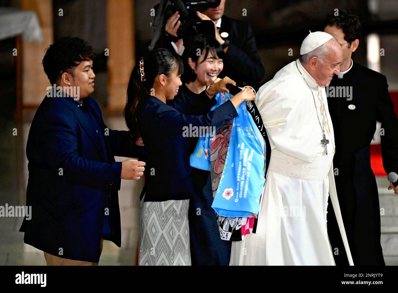 Pope Francis is given a happi coat (traditional Japanese straight ...