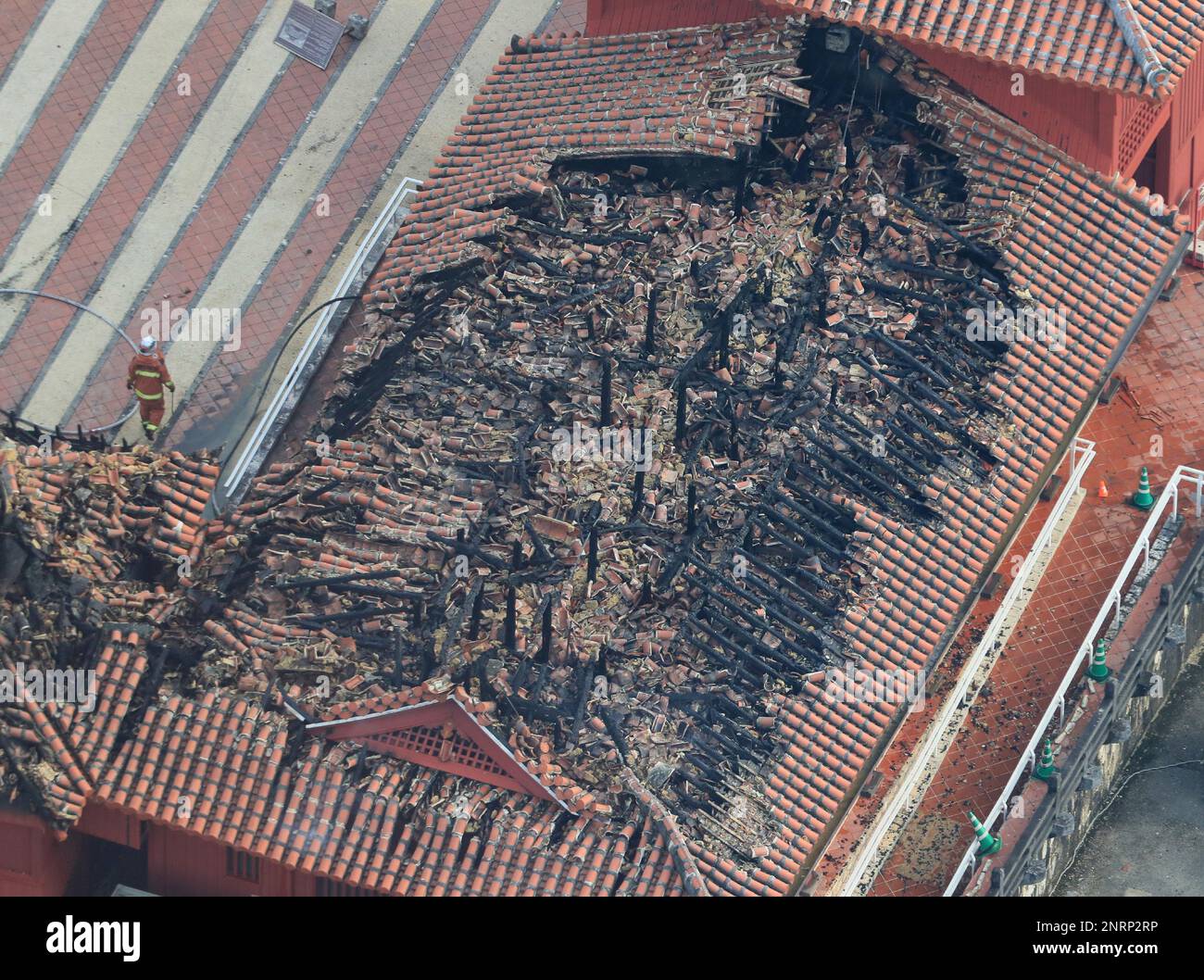 An aerial photo shows charred remains of Shurijo Castle, after it ...