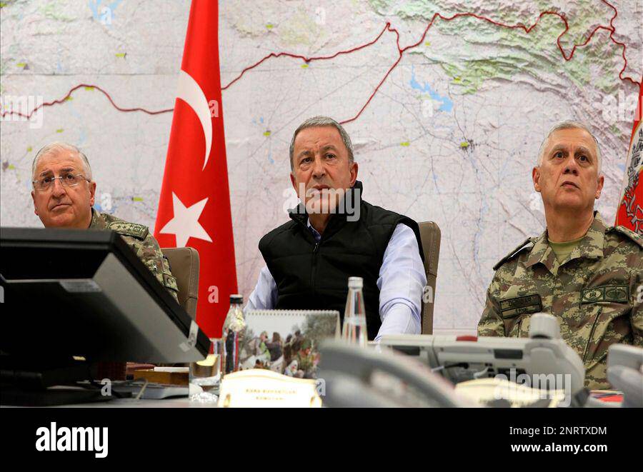 Turkey's Defense Minister Hulusi Akar, center, with Chief of the ...