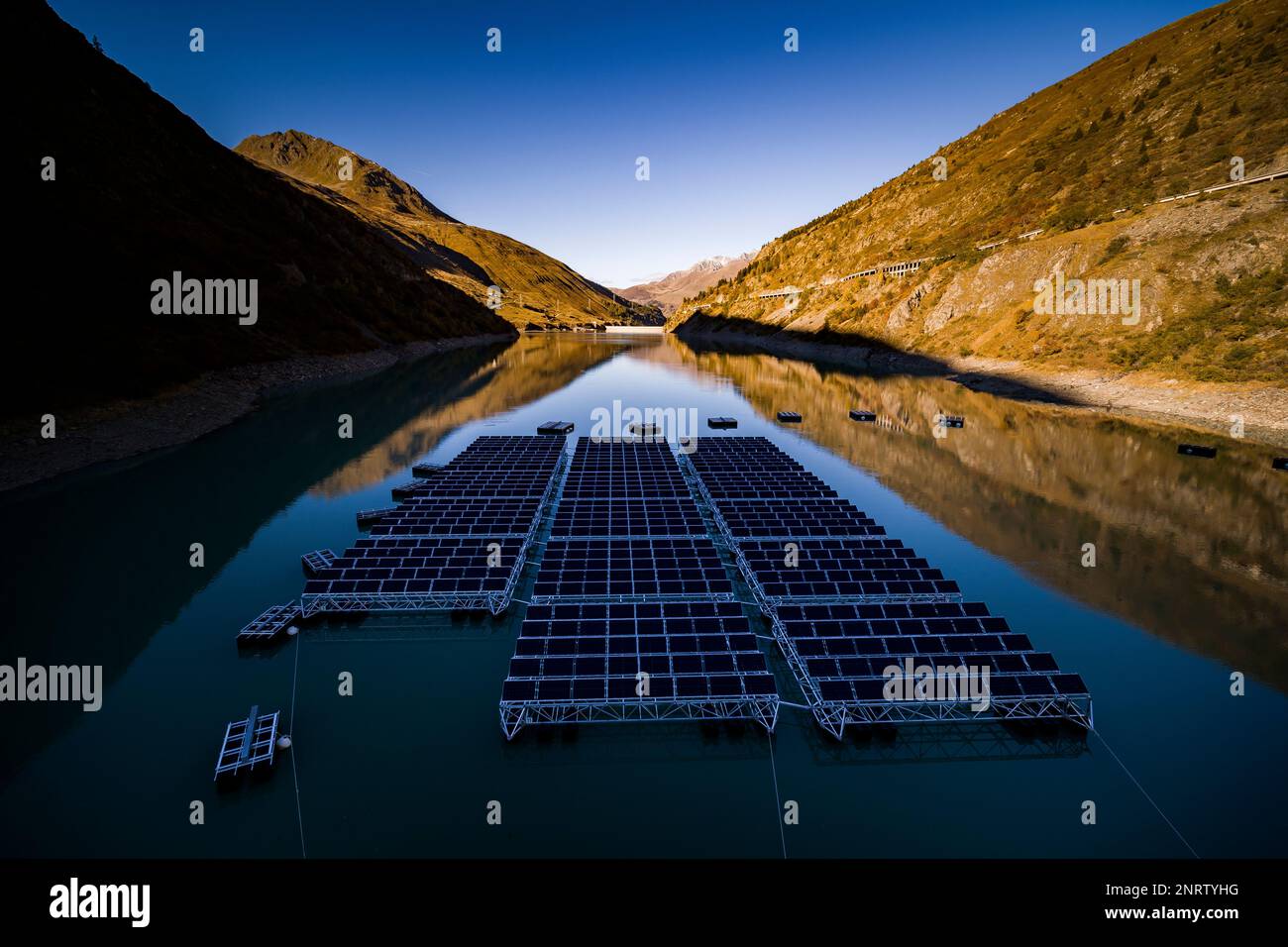 Floating barges with solar panels are pictured on the 'Lac des Toules ...