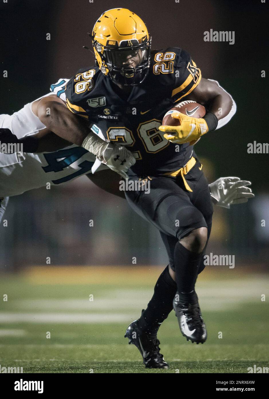 Appalachian State junior running back Marcus Williams Jr. (26) breaks away from Coastal Carolina ...