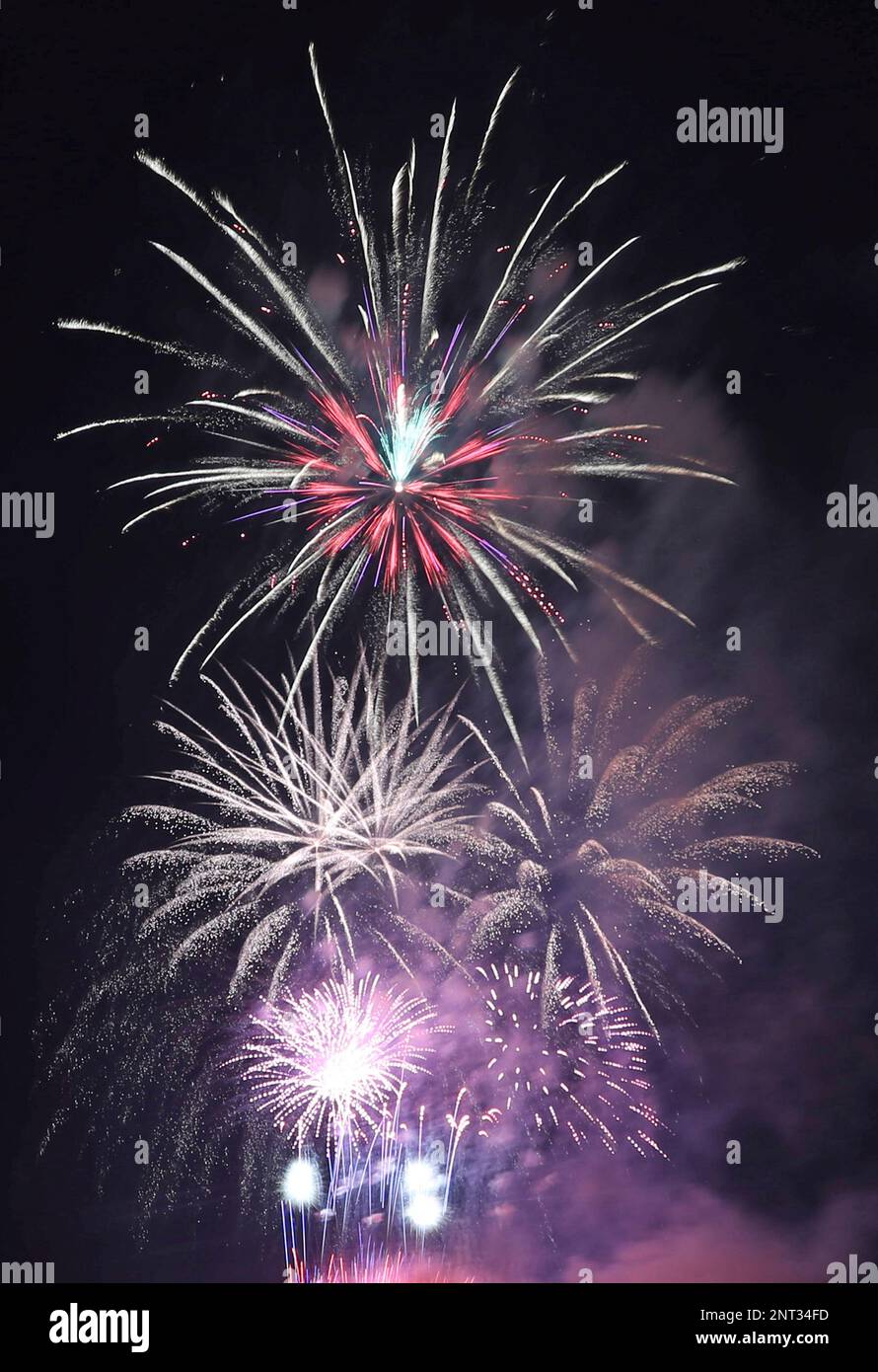 A photo shows fireworks launching in the night sky during the Omagari ...