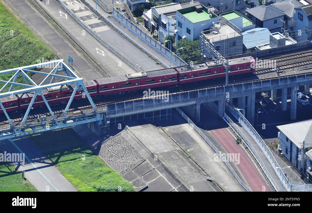 An aerial photo shows a Keisei Electric Railway train car stopped by a ...