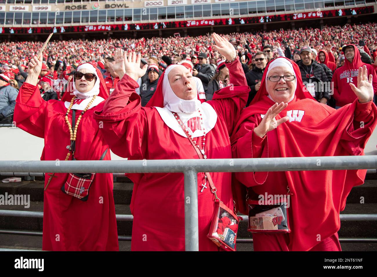 Wisconsin Badgers fans dressed as nuns dance during Jump Around during ...