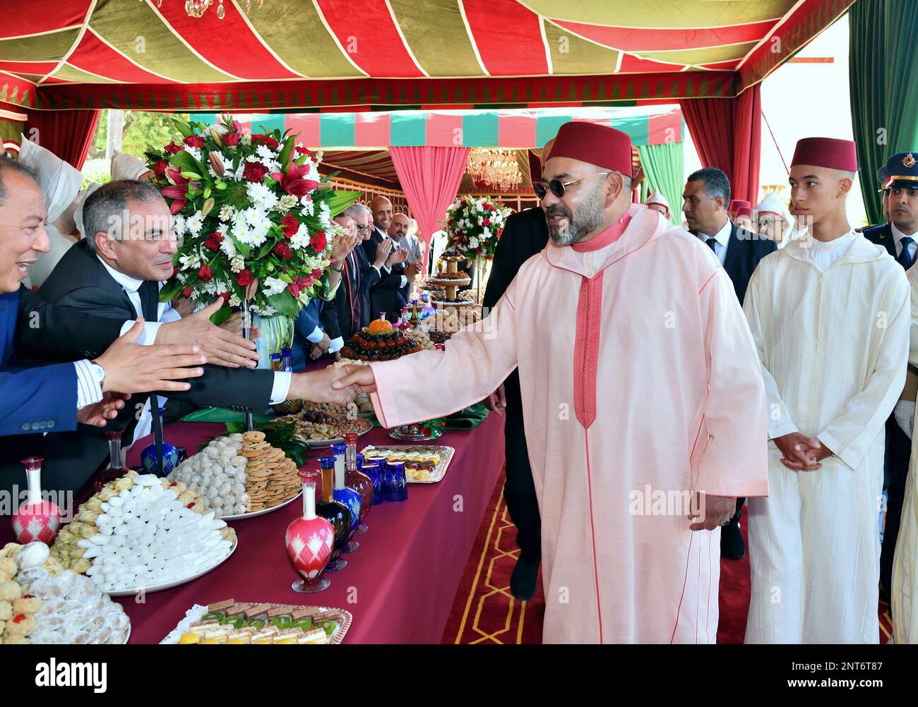 In this photo provided by the Moroccan Royal Palace, Morocco's King ...