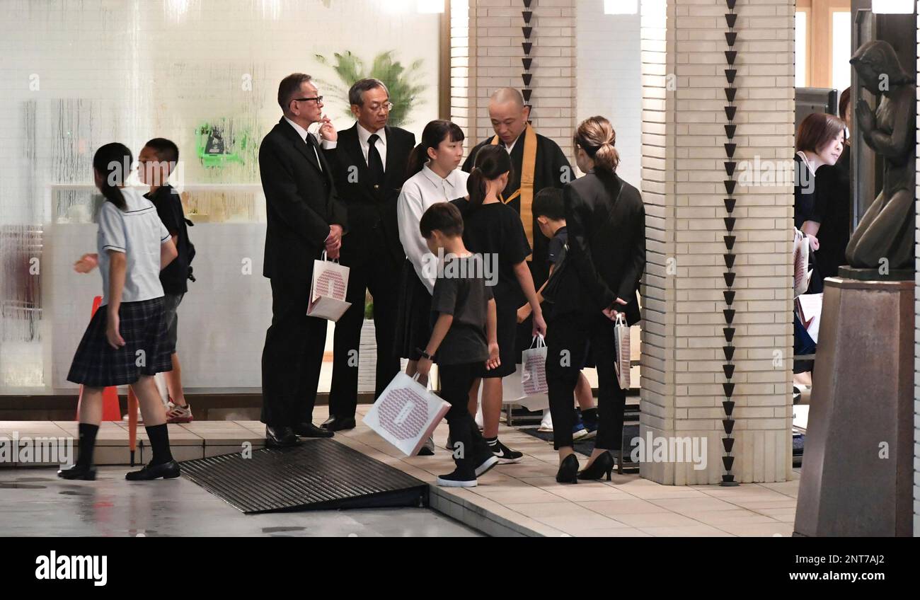 People attend a wake for a victim due to the arson of Kyoto Animation ...