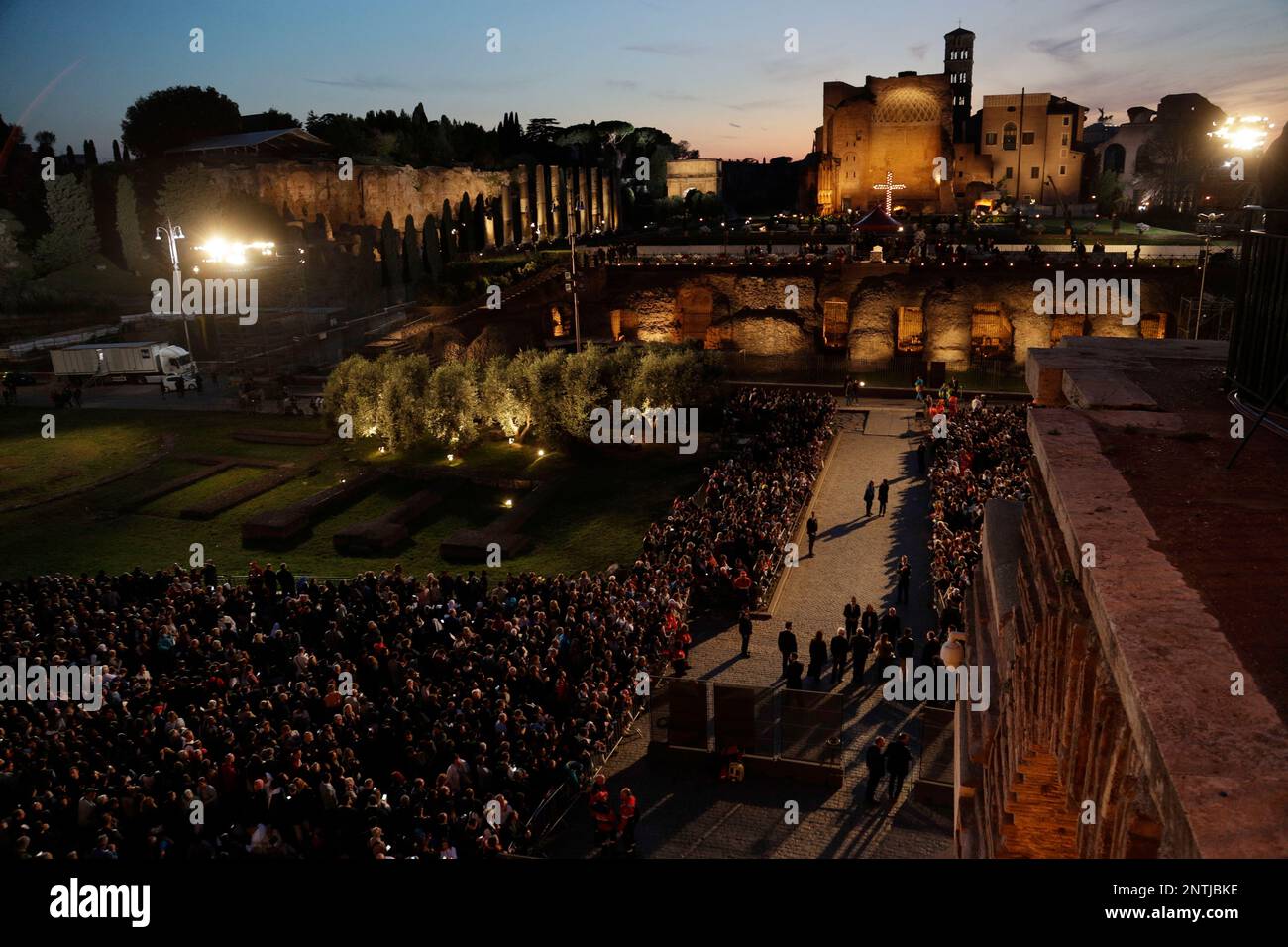 People gather to attend the Via Crucis (Way of the Cross) torchlight ...