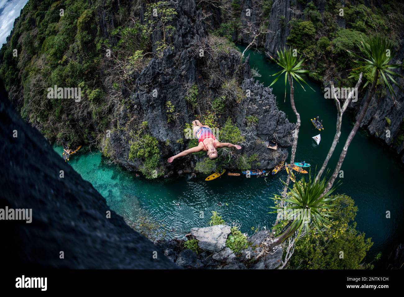 Women's winner Rhiannan Iffland of Australia dives from a rock at the ...
