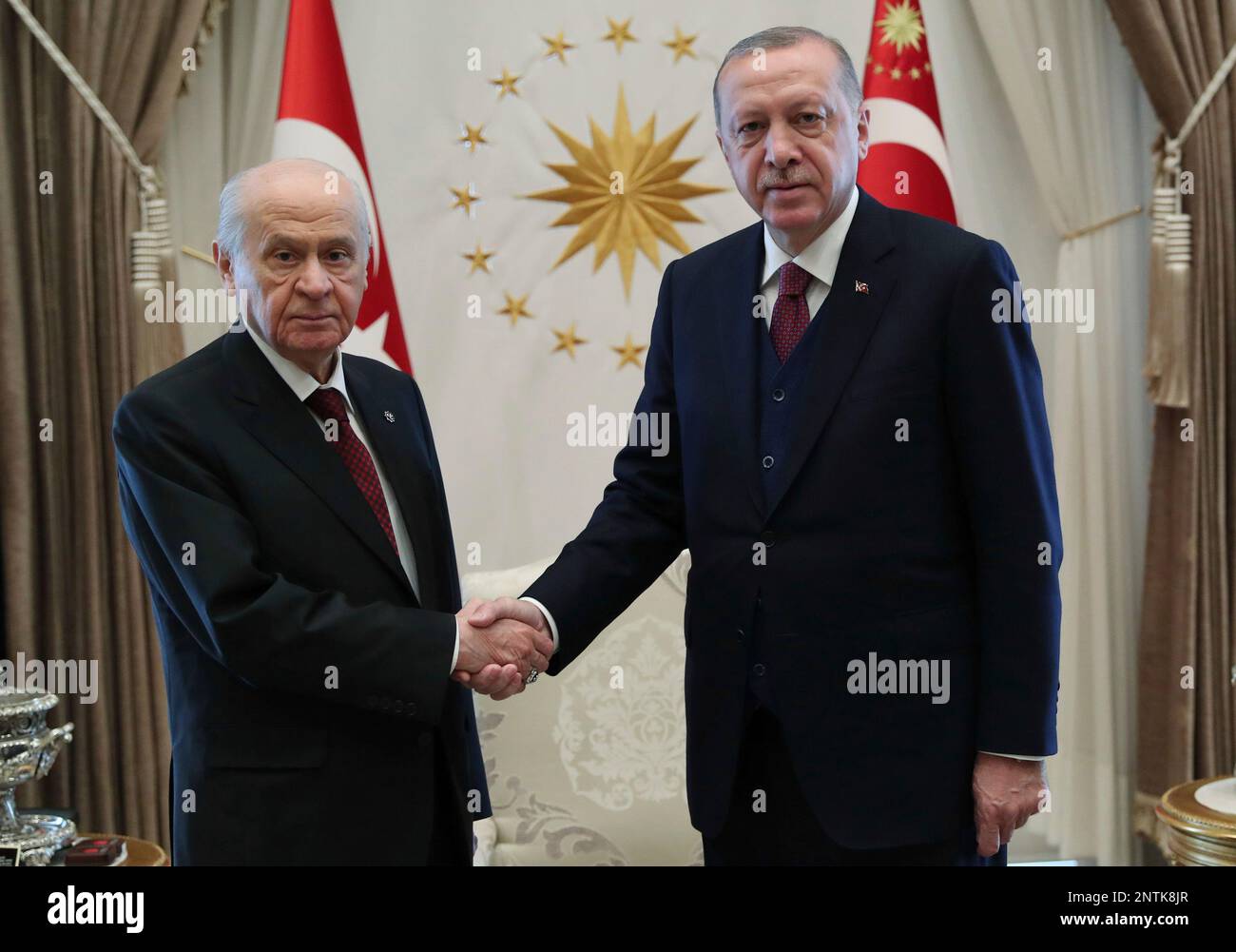 Turkey's President Recep Tayyip Erdogan, right, shakes hands with ...