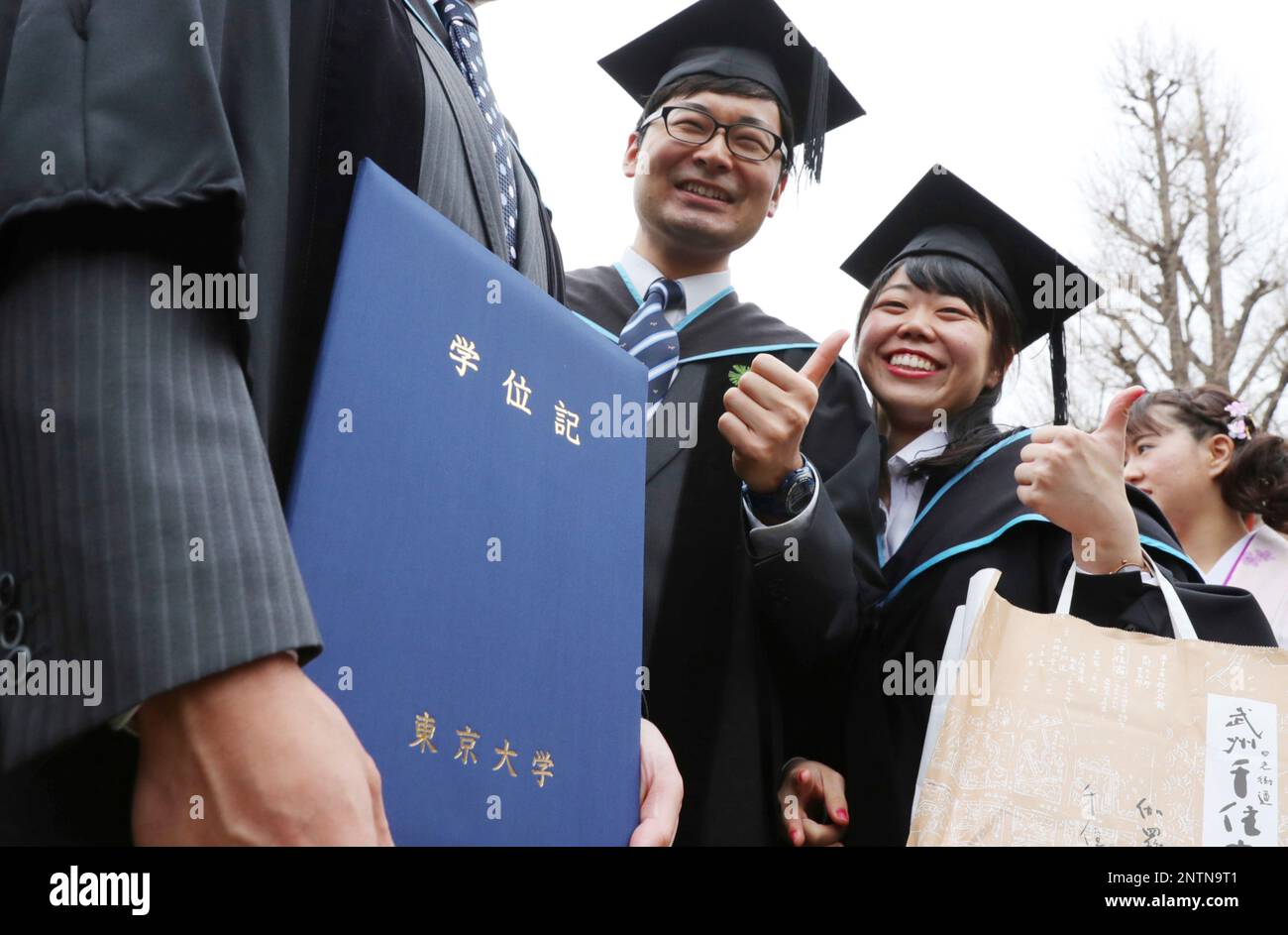 Graduate students of Tokyoi University pose for a photograph in front ...