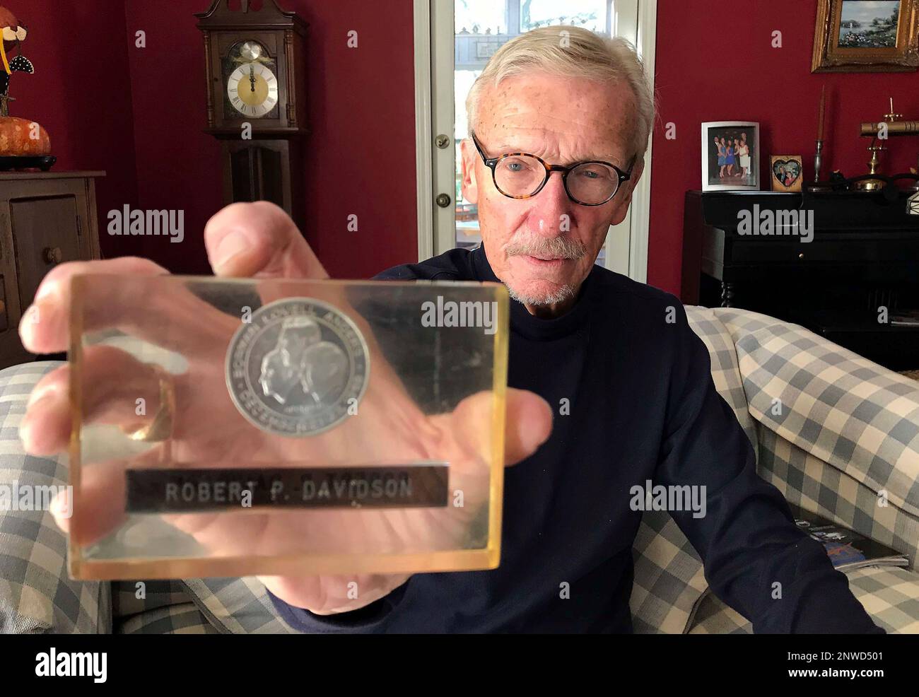 In this Oct 16, 2018 photo, Bob Davidson holds a coin made with metal ...