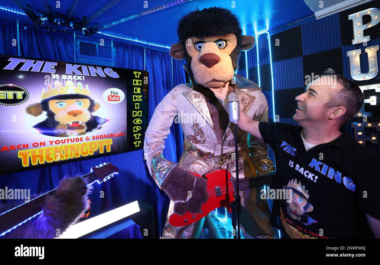 Jared Sanchez, right, adjusts King Puff, an animatronic lion character ...