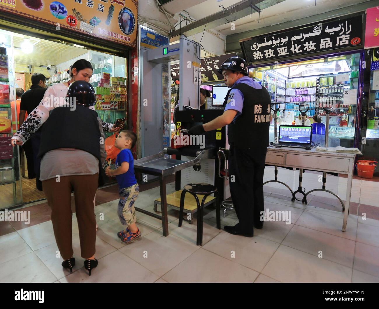 A monitor of a computer at an inspection point shows many faces in ...