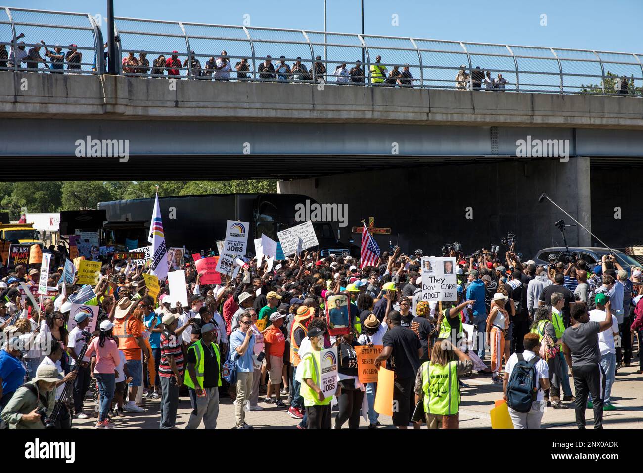 Thousands of anti-violence protesters pour into the inbound lanes of ...