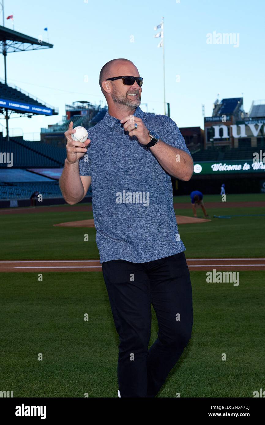 Former Chicago Cubs catcher David Ross prepares to throw out the first ...
