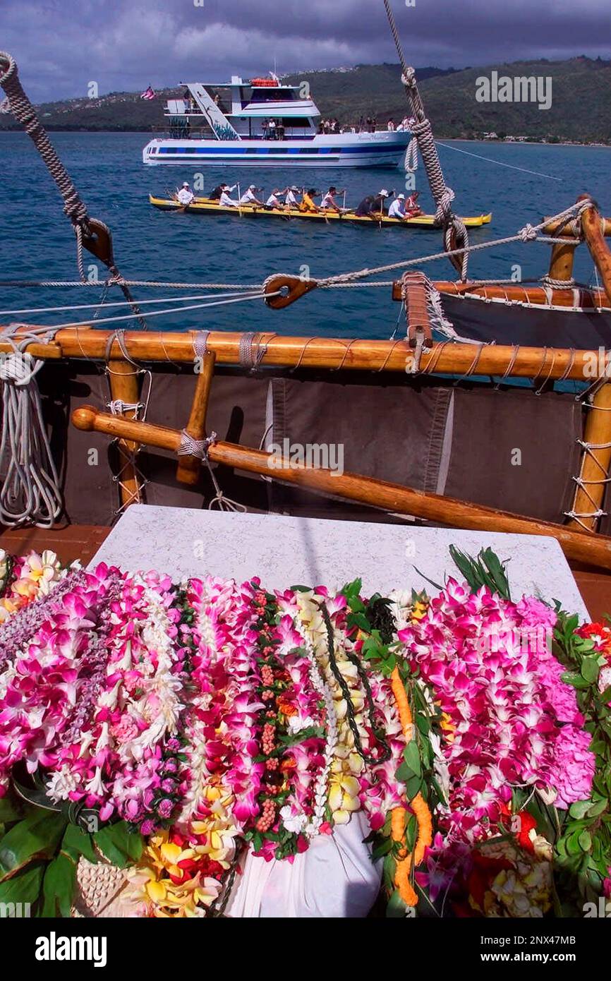FILE - In this March, 4, 2001, file photo, flower offerings and lei for ...