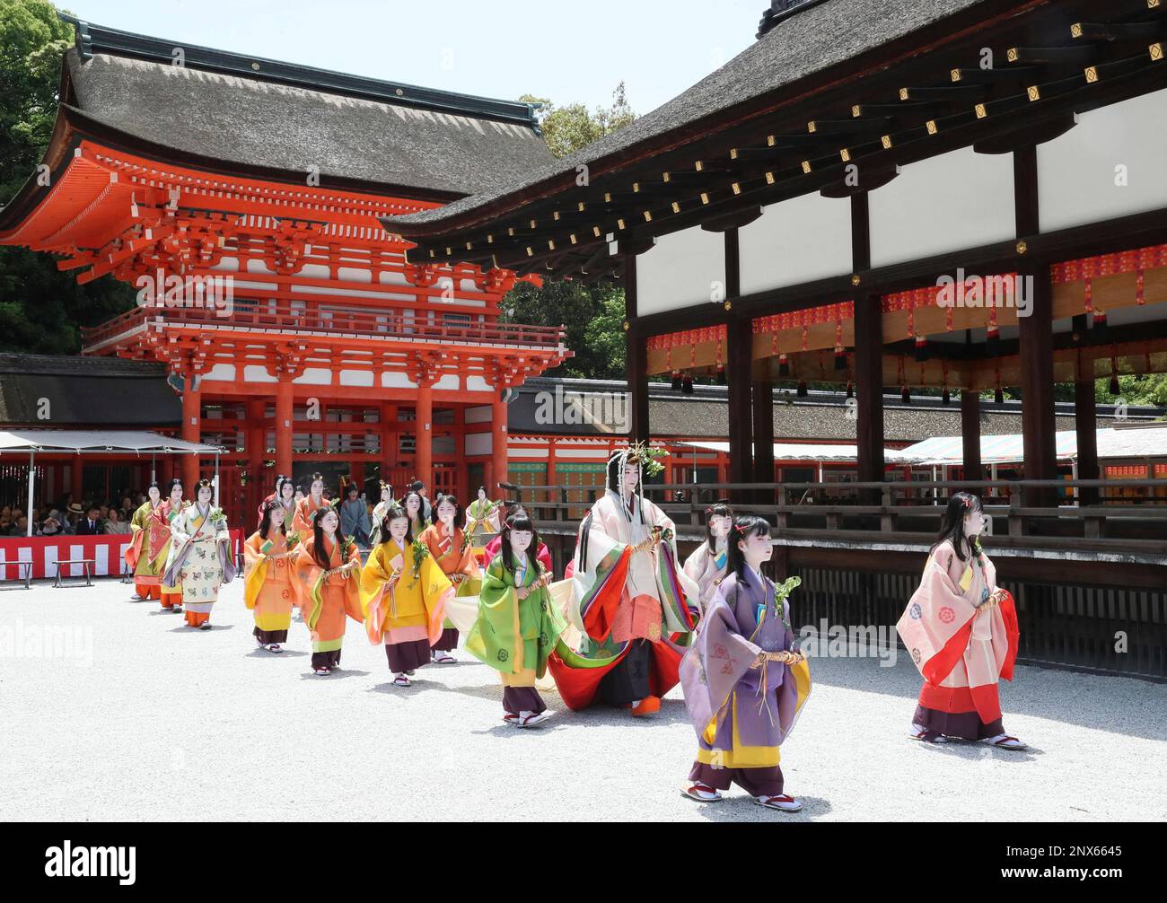 Shiho Sakashita (C) the queen "Saiodai", dressed in traditional multi ...