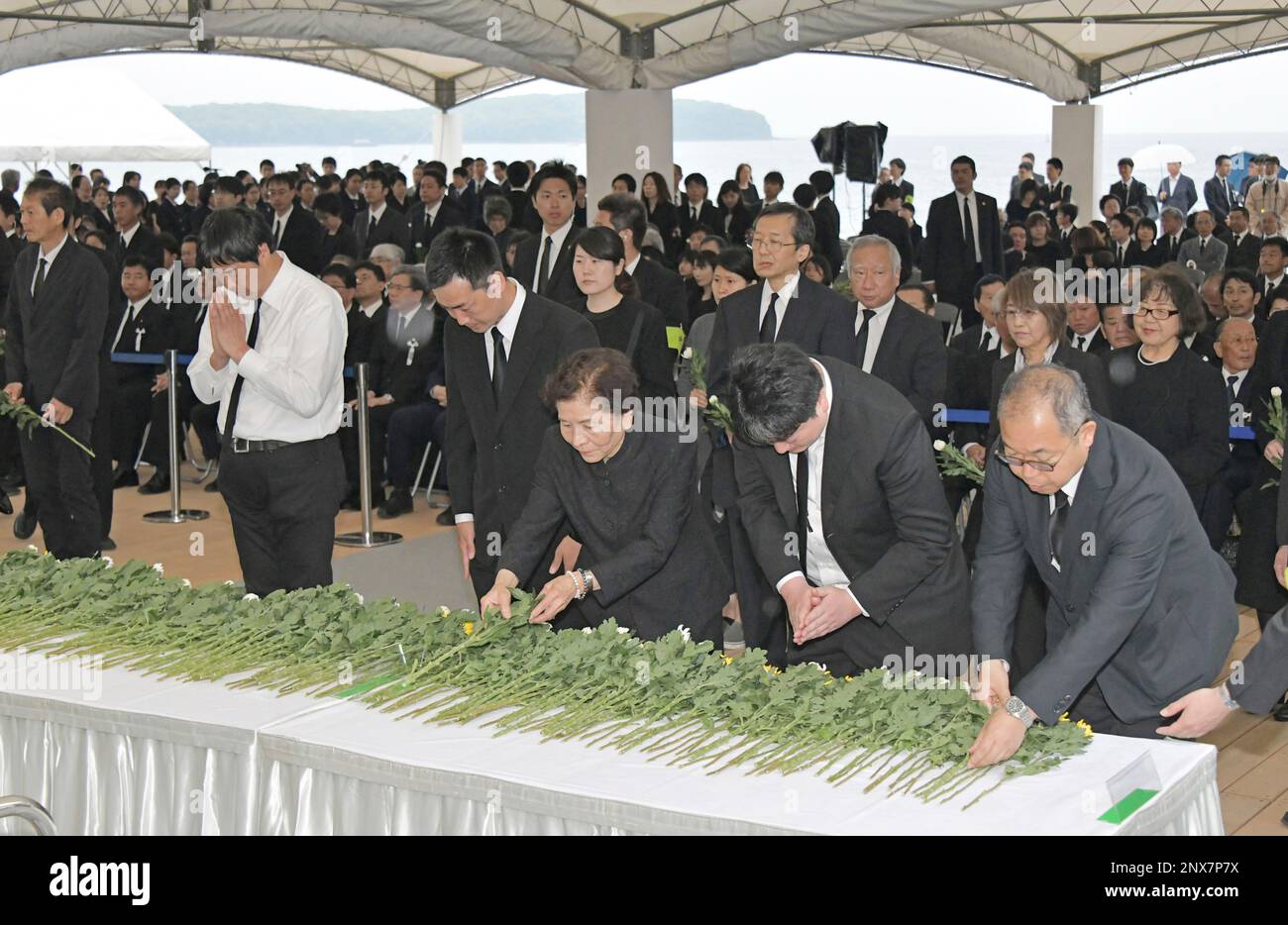 About 700 people including patients offer flowers and pray for the ...