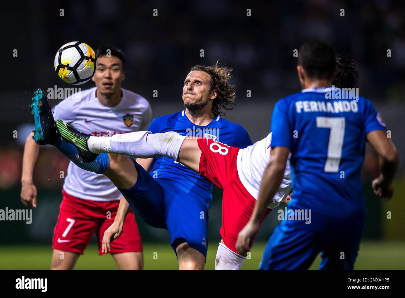 Uruguayan football player Diego Forlan, center, of Hong Kong's Kitchee ...