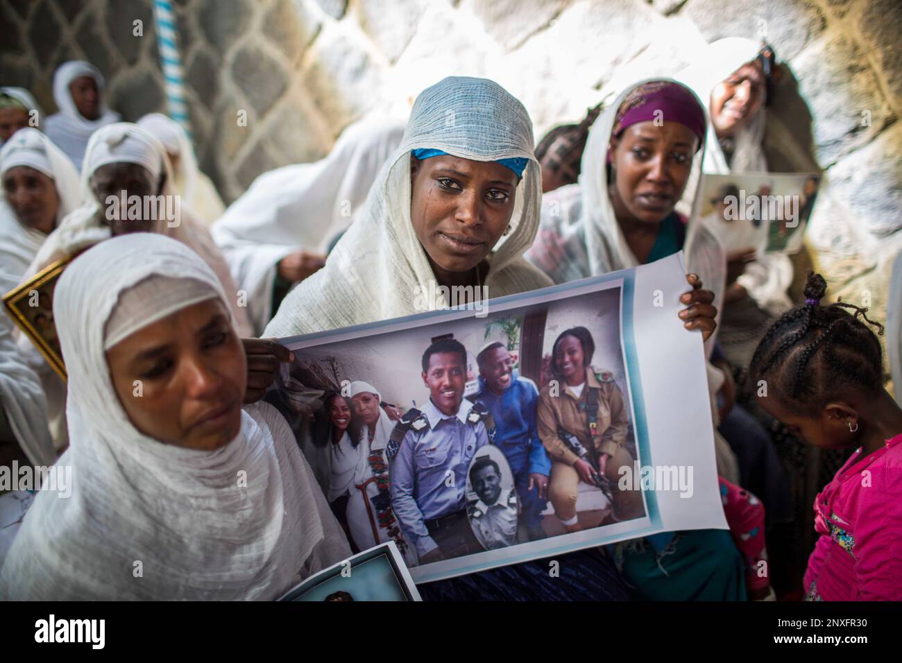 Members of Ethiopia's Jewish community hold pictures of their relatives ...