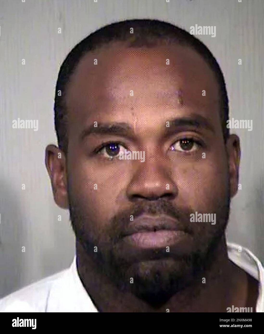 FILE - This undated file booking photo provided by the Maricopa County ...