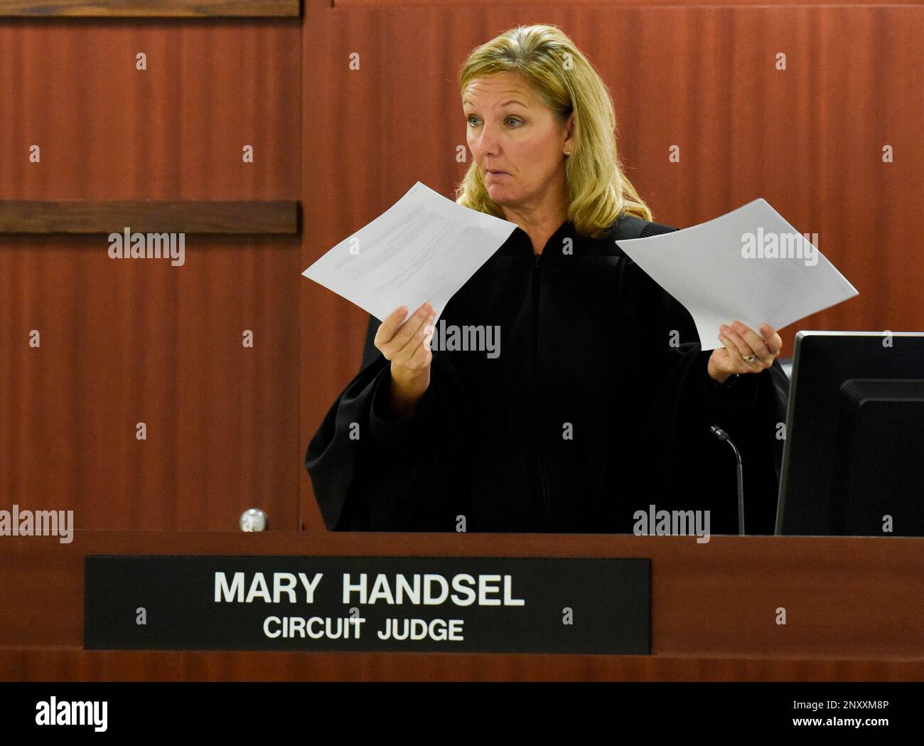 Circuit court judge Mary Handsel gives the jury instructions to begin ...